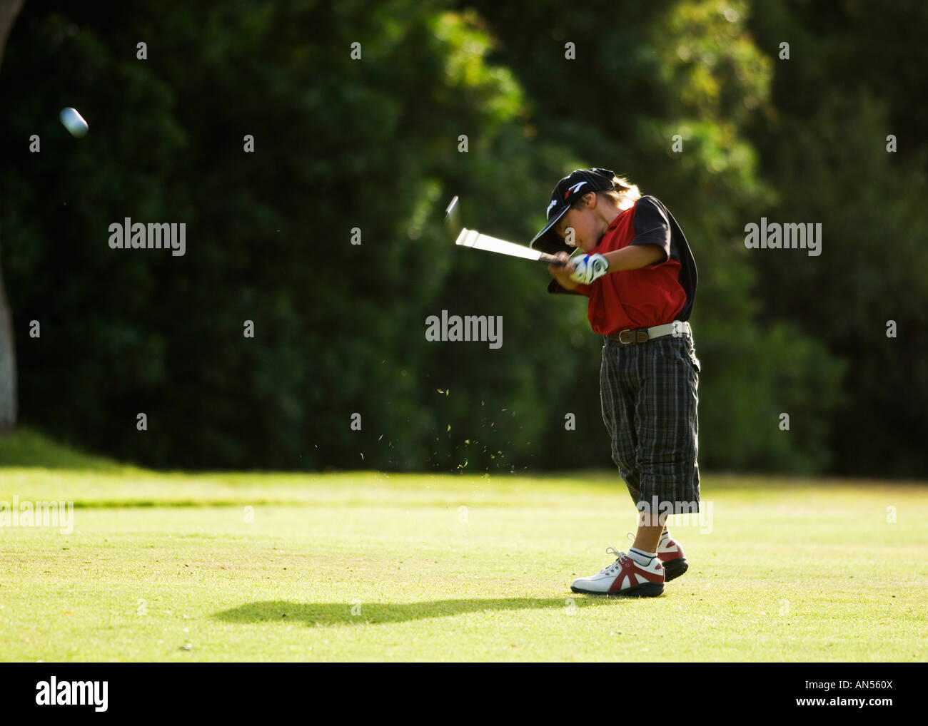 young boy playing golf Stock Photo - Alamy