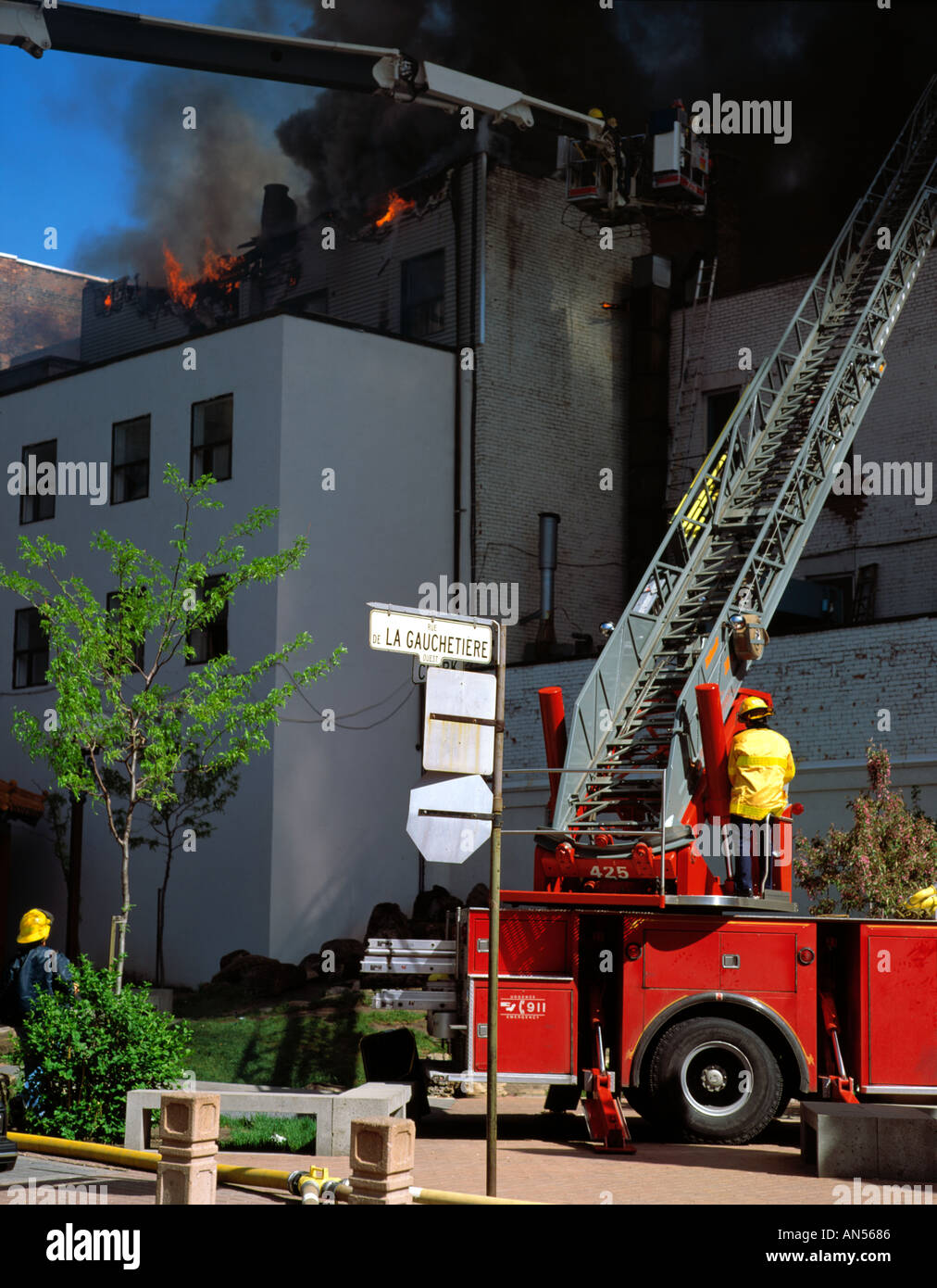 Firemen fighting fire in Chinatown Montreal Stock Photo - Alamy
