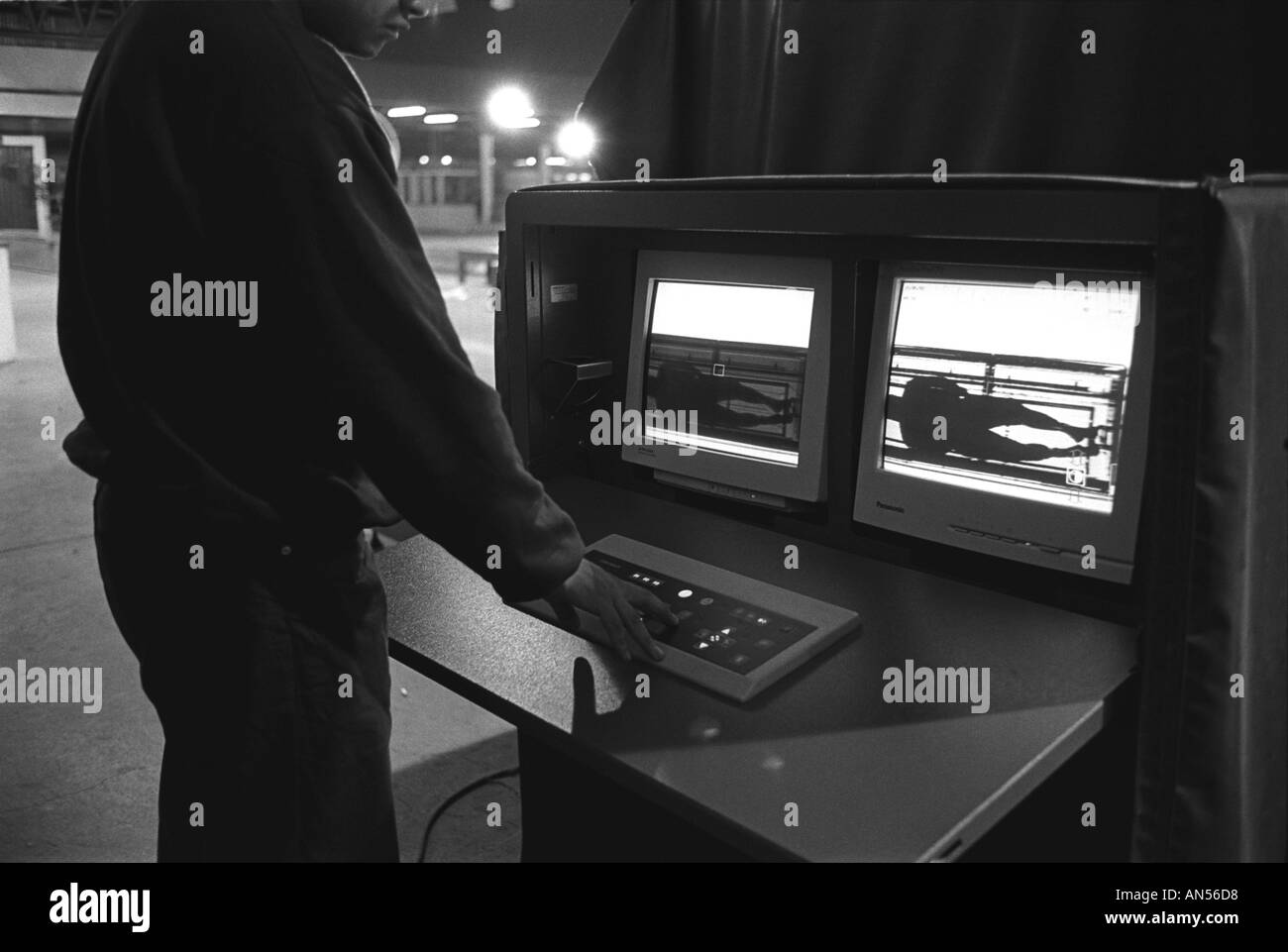 A Mexican airport CustomÕs agent reviews the x ray monitor image of a ...