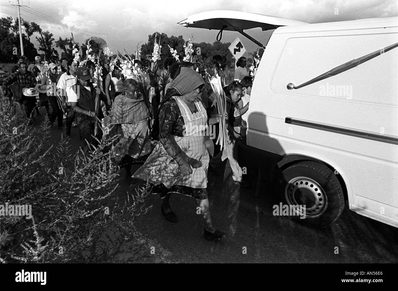 Townspeople accompany the body of Lilia Machorro on the highway leading ...