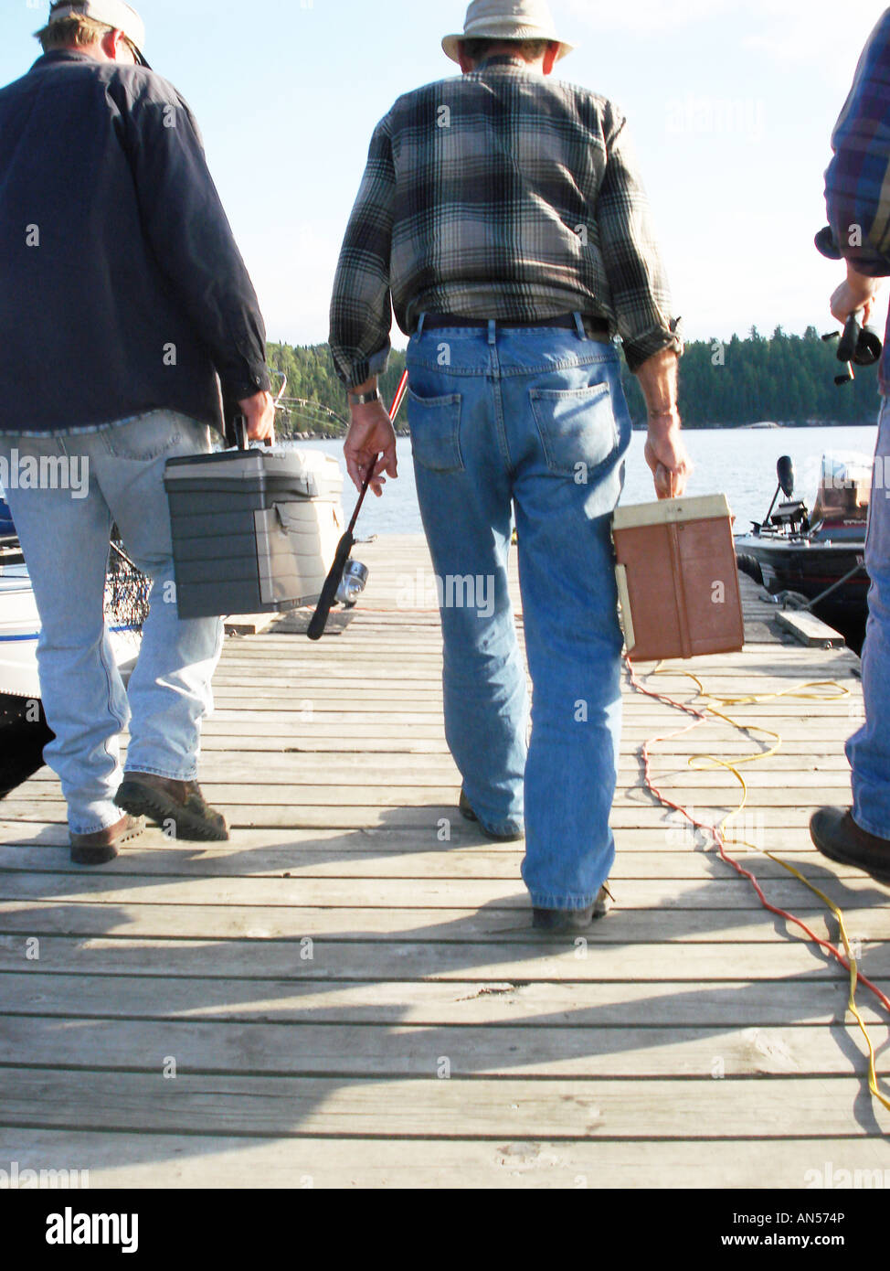 Fishermen on a dock with their fishing gear Stock Photo - Alamy