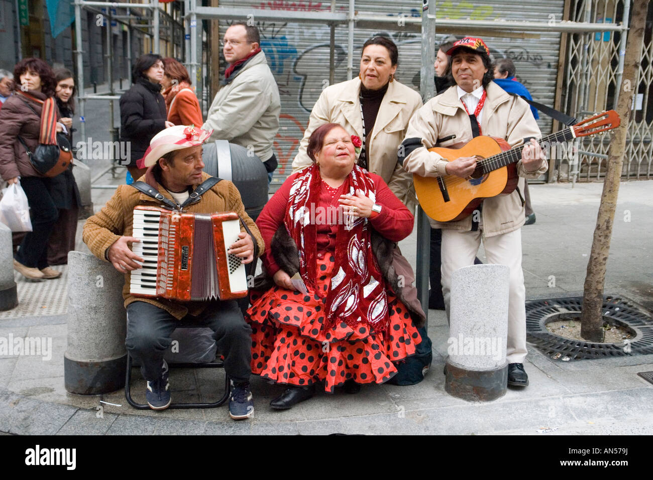 A colourful gipsy threesome performing in the street (Spain). Trio ...