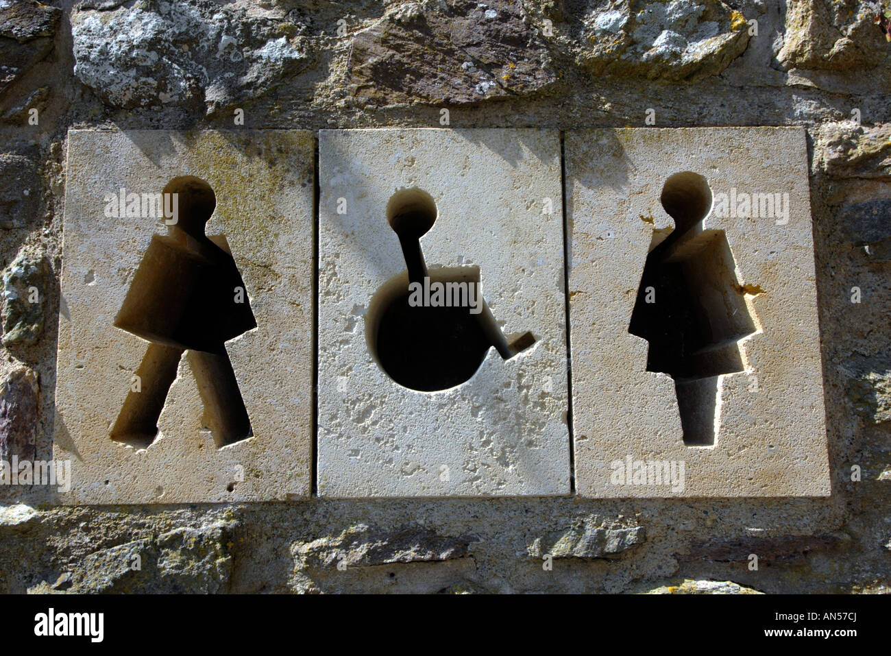 Toilet sign carved out of stone Stock Photo - Alamy