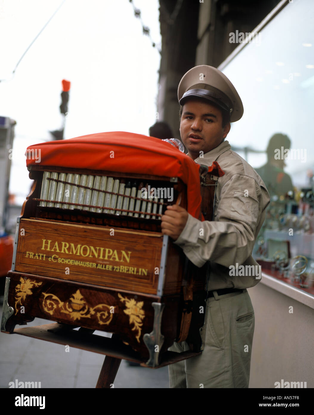An organ grinder plays on the street in downtown Mexico City Stock ...