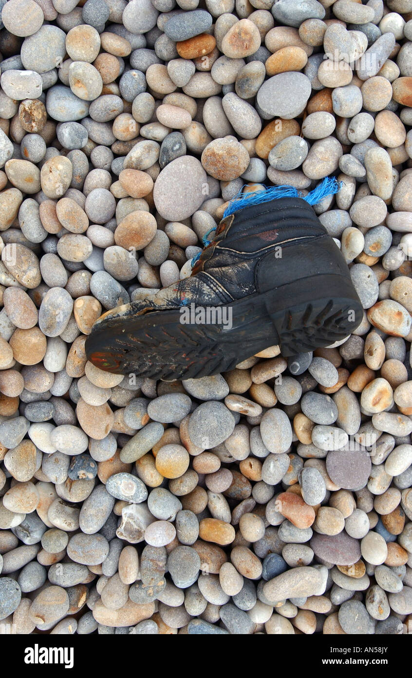A single shoe on a pebble beach Stock Photo - Alamy