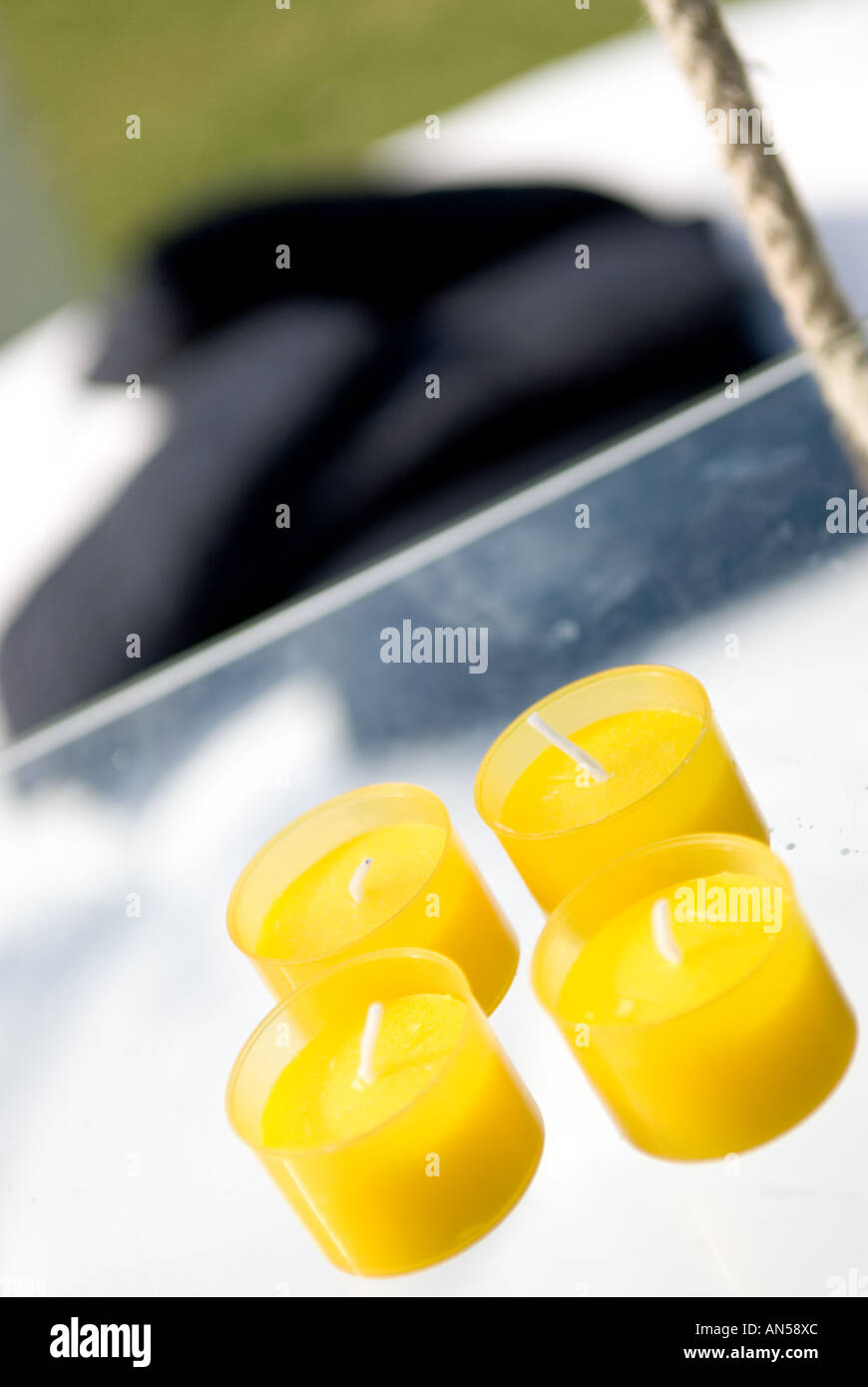 Four yellow candles hi-res stock photography and images - Alamy