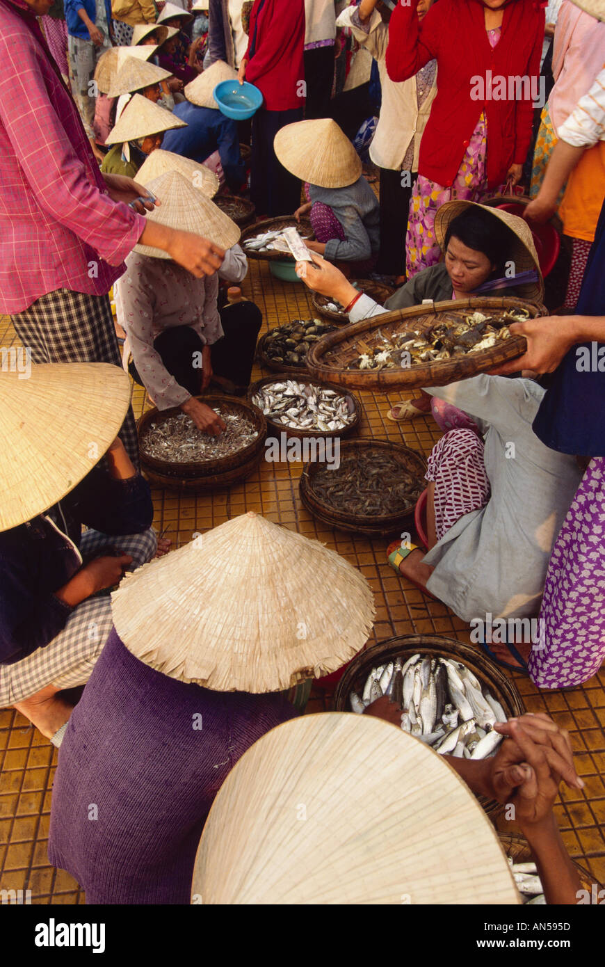 Local women trading fish on the quay in Hoi An Stock Photo - Alamy