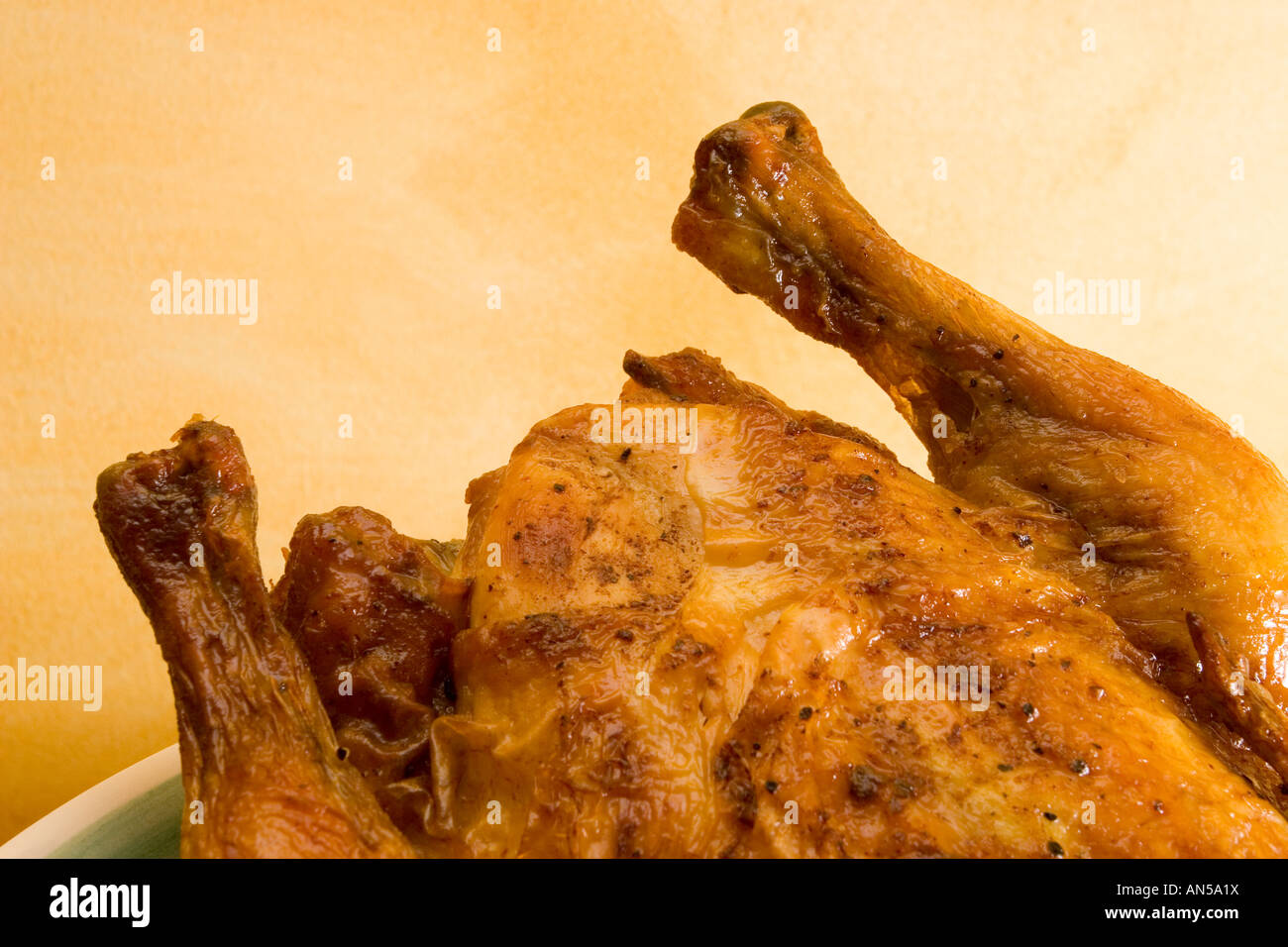 Prepared whole chicken on a plate copy space Stock Photo - Alamy