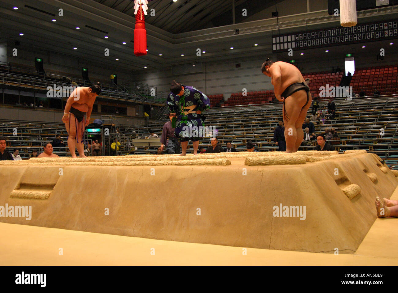 Sumo wrestlers bow politely at each other in a traditional pre fight ...