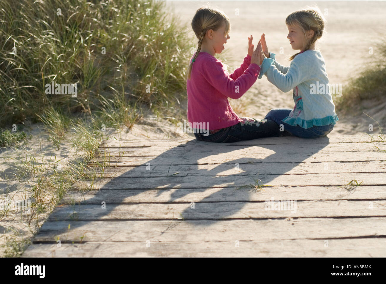 two young friends playing outside Stock Photo - Alamy