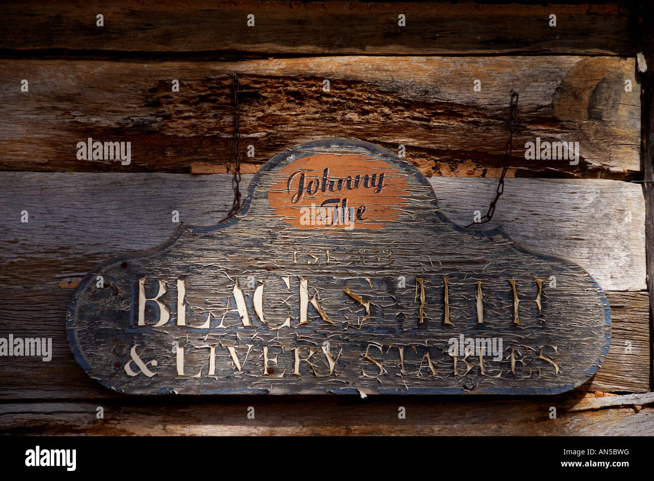An old worn blacksmith sign Stock Photo - Alamy