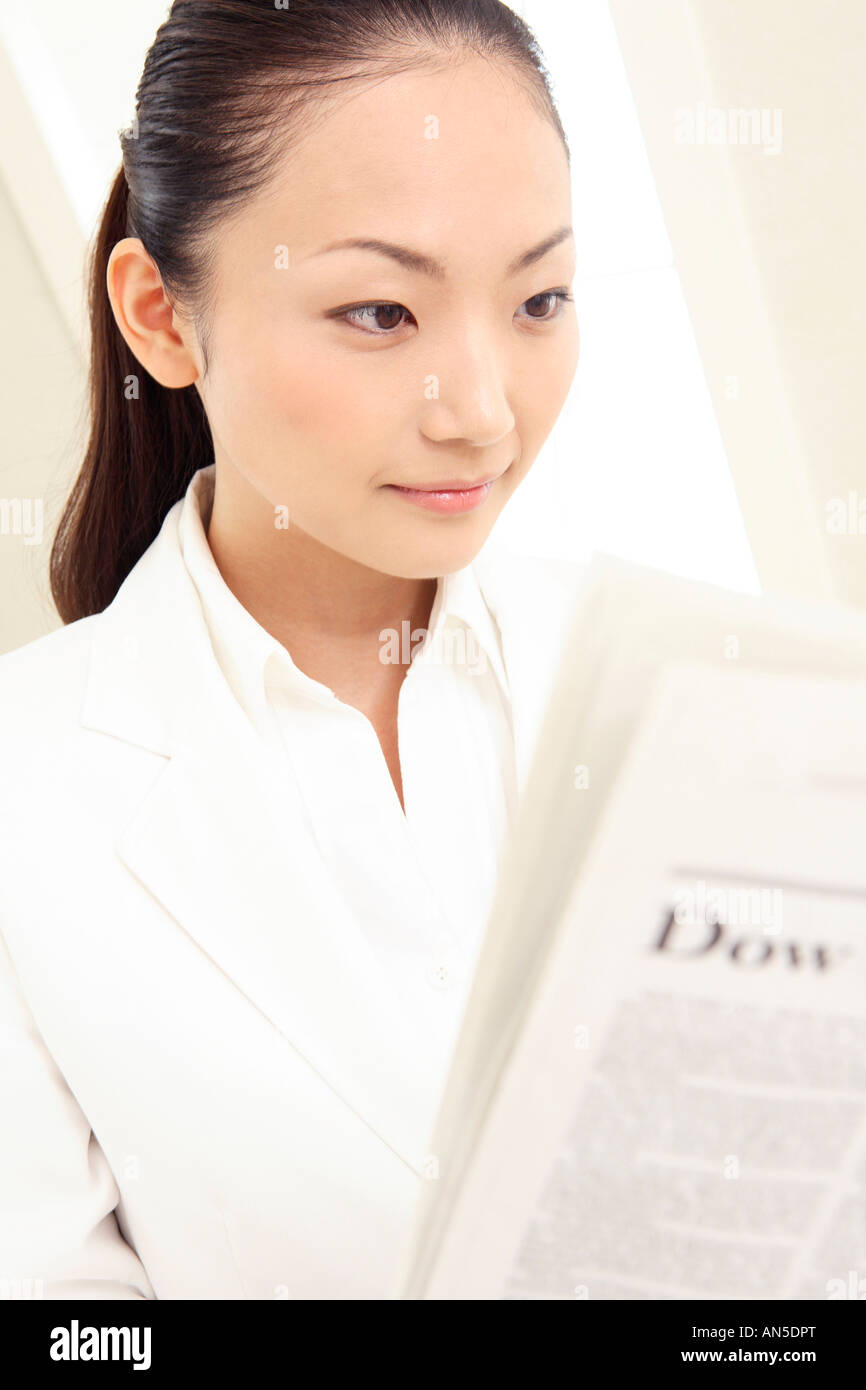 Office lady reading newspaper hi-res stock photography and images - Alamy