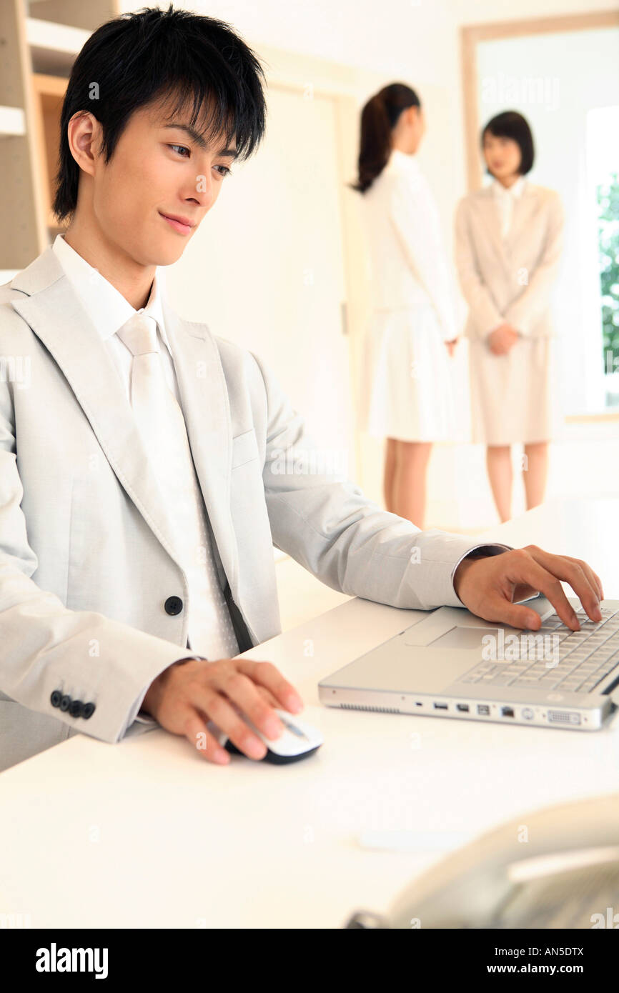 Office worker operating a PC Japanese Stock Photo - Alamy