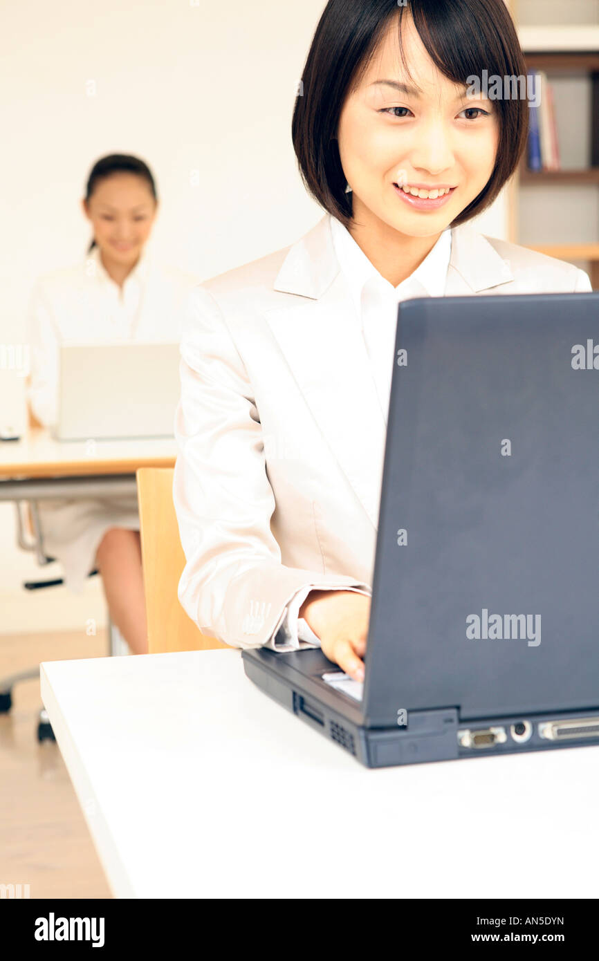Office lady operating a PC Stock Photo - Alamy