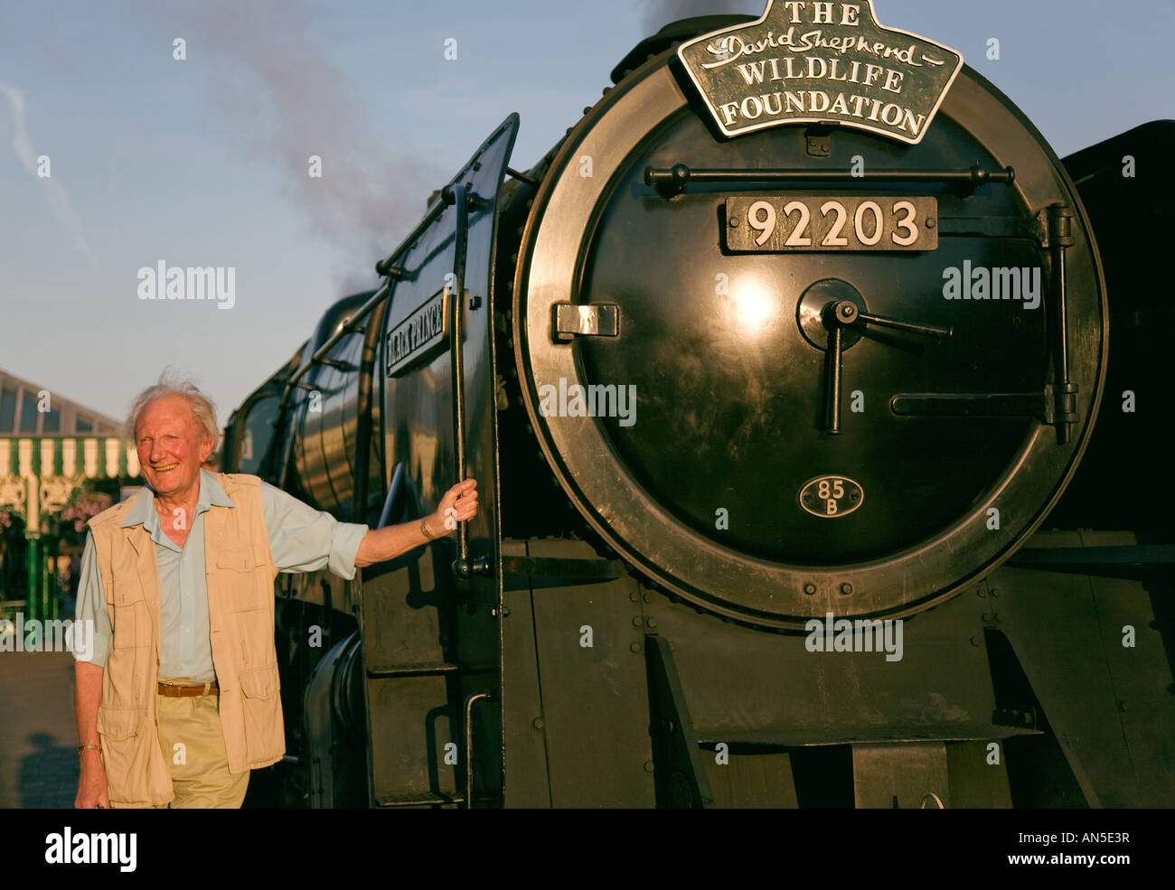 Artist and conservationist David Shepherd poses with his steam train ...