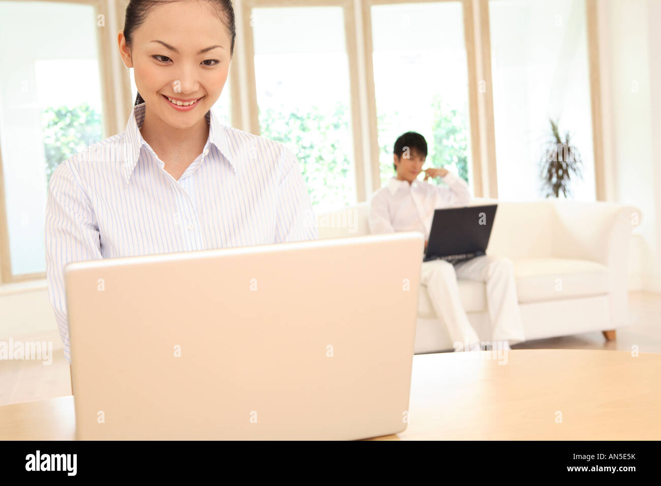 Office lady operating a PC Stock Photo - Alamy