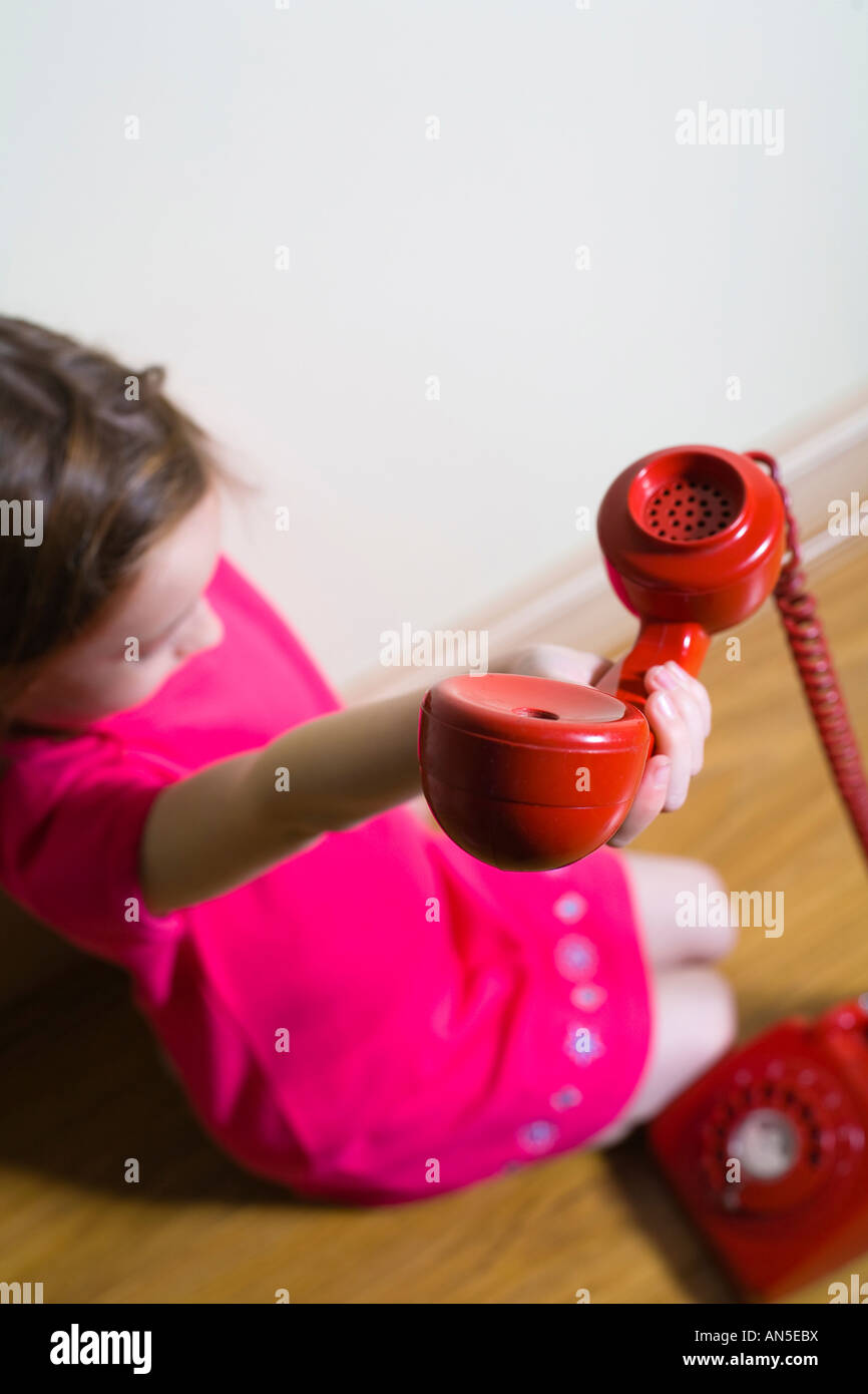 Young girl passing the phone to another person Stock Photo - Alamy