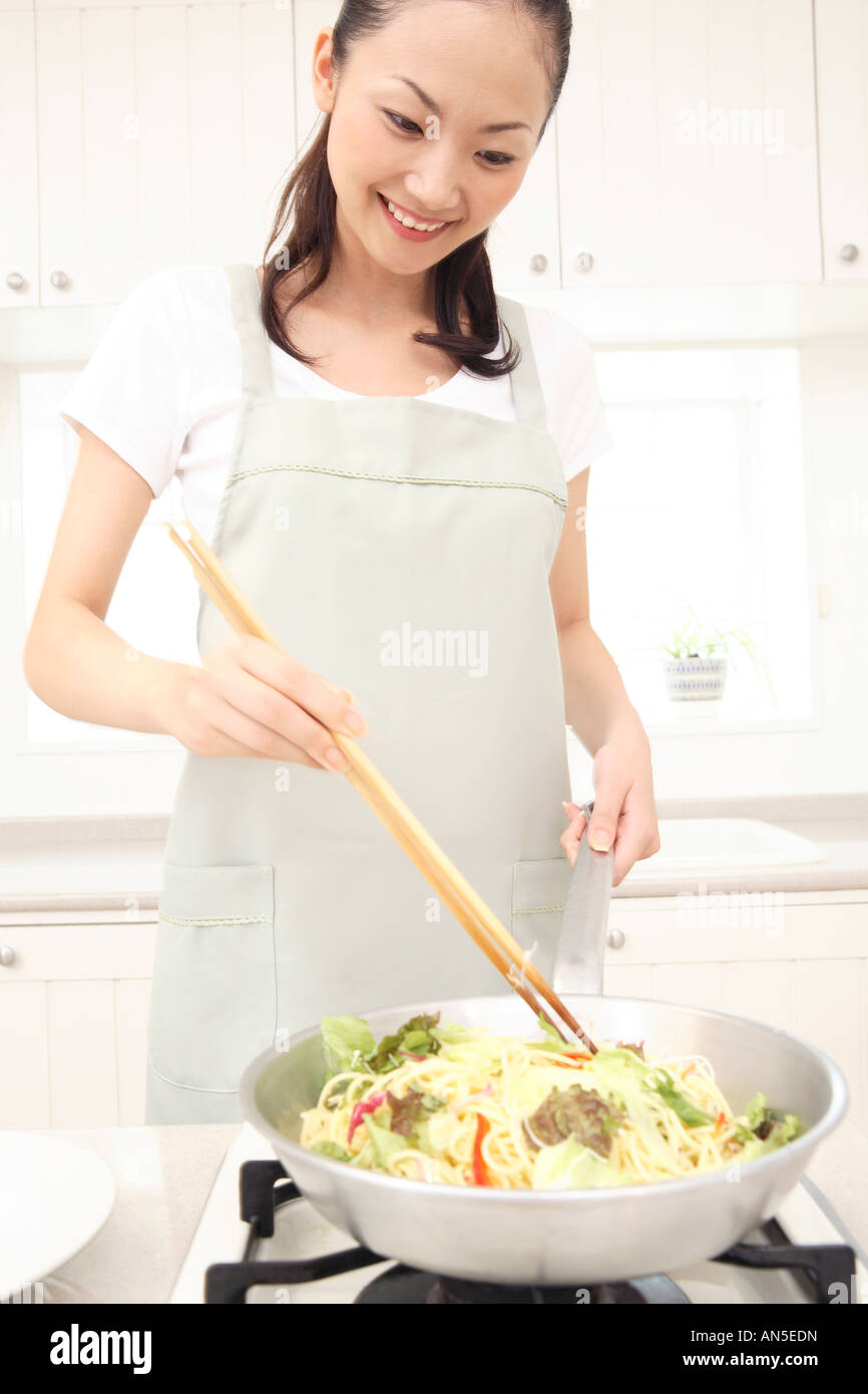 Japanese woman cooking Stock Photo - Alamy