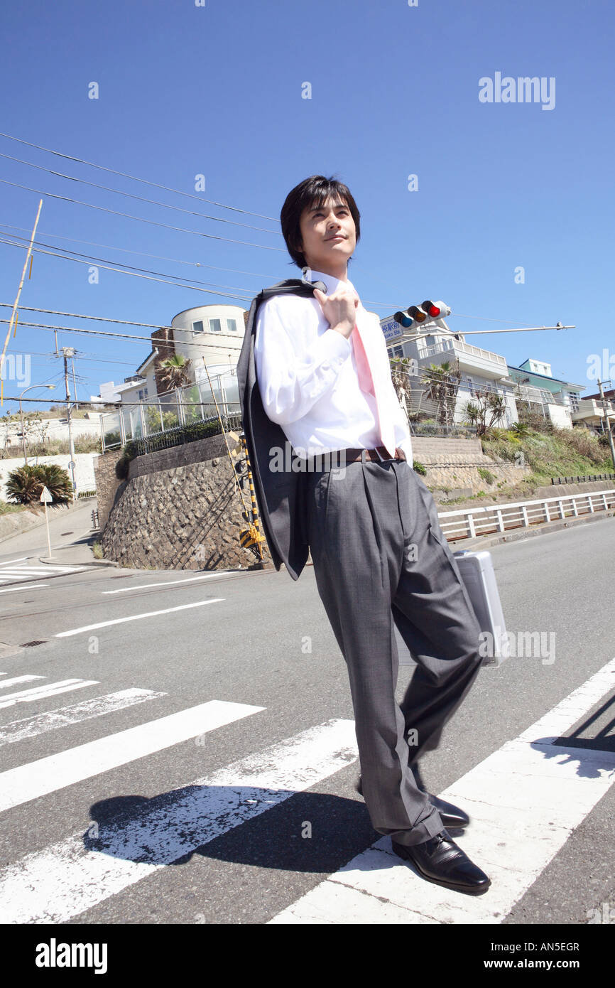 Japanese office worker crossing zebra crossing Stock Photo - Alamy