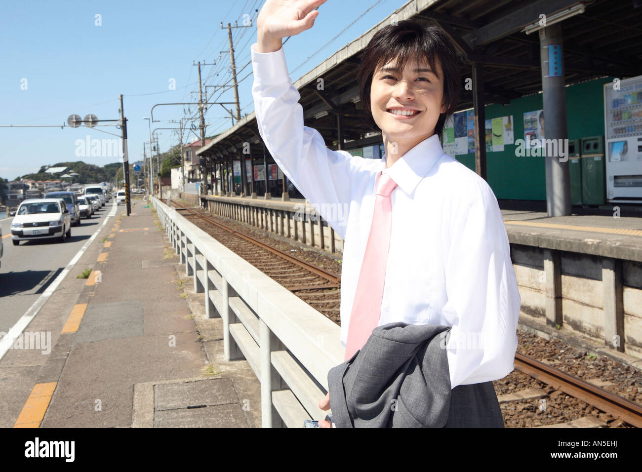 Japanese office worker raising hand Stock Photo - Alamy