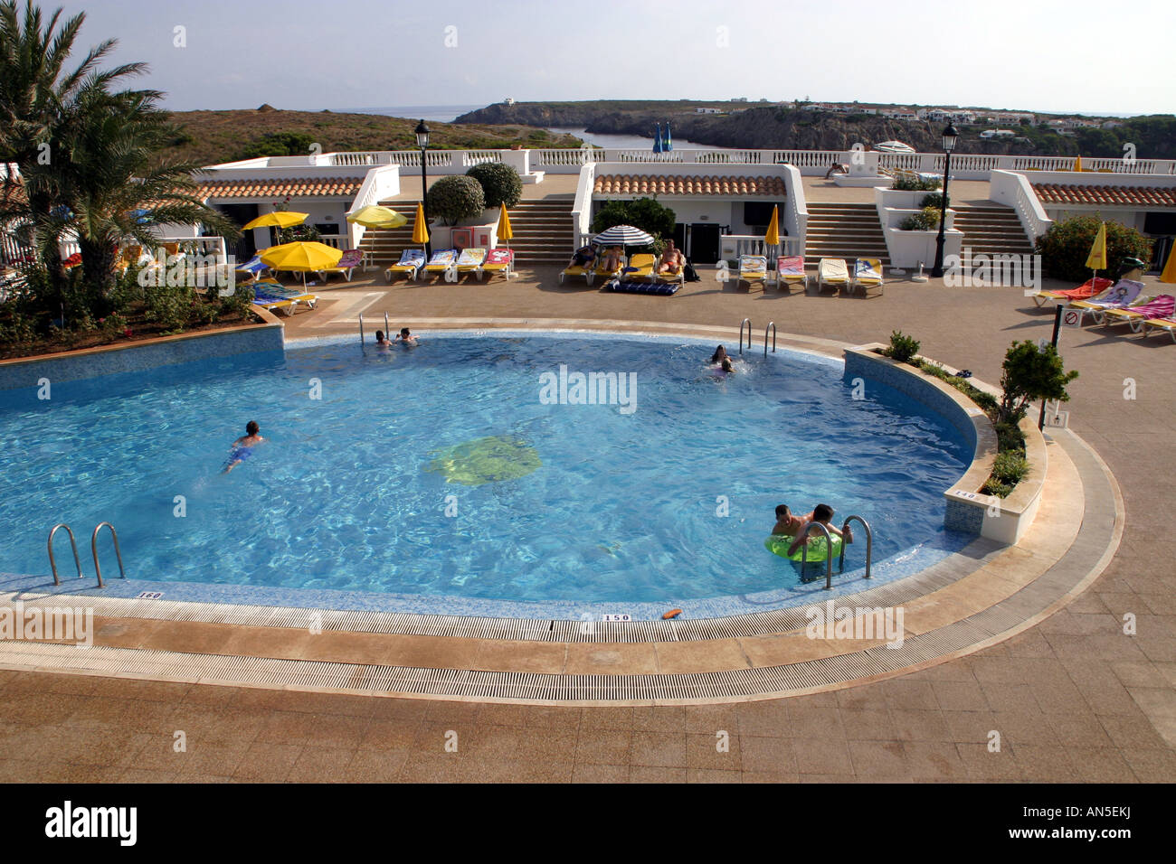 Children enjoying the swimming pool at a holiday hotel in Menorca Stock ...