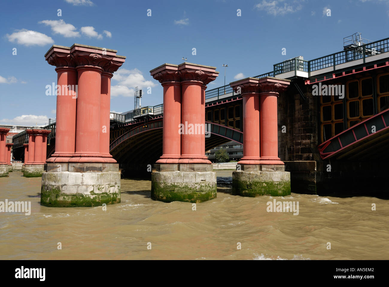 Blackfriars Railway Bridge across the Thames London. Ornate red columns ...