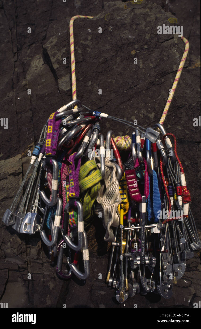 Climbing equipment hung at the bottom of a rock climb Stock Photo - Alamy