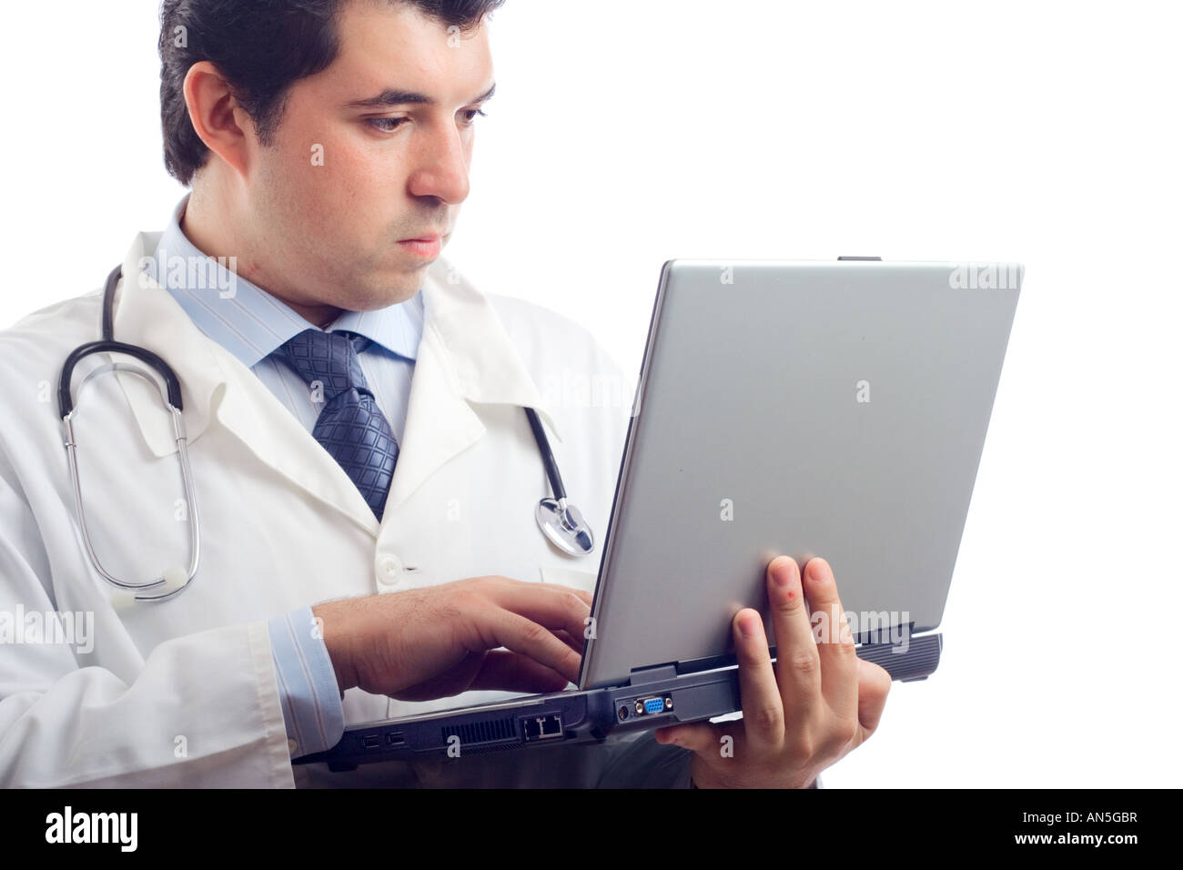 Hospital doctor working on a laptop computer Stock Photo - Alamy