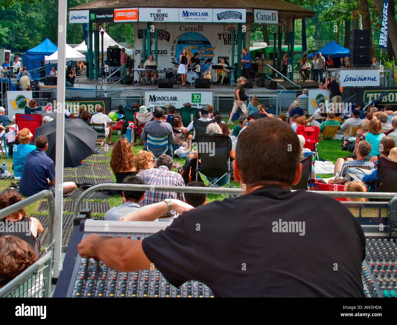 Sound man at the mixing board at an outdoor concert Stock Photo - Alamy