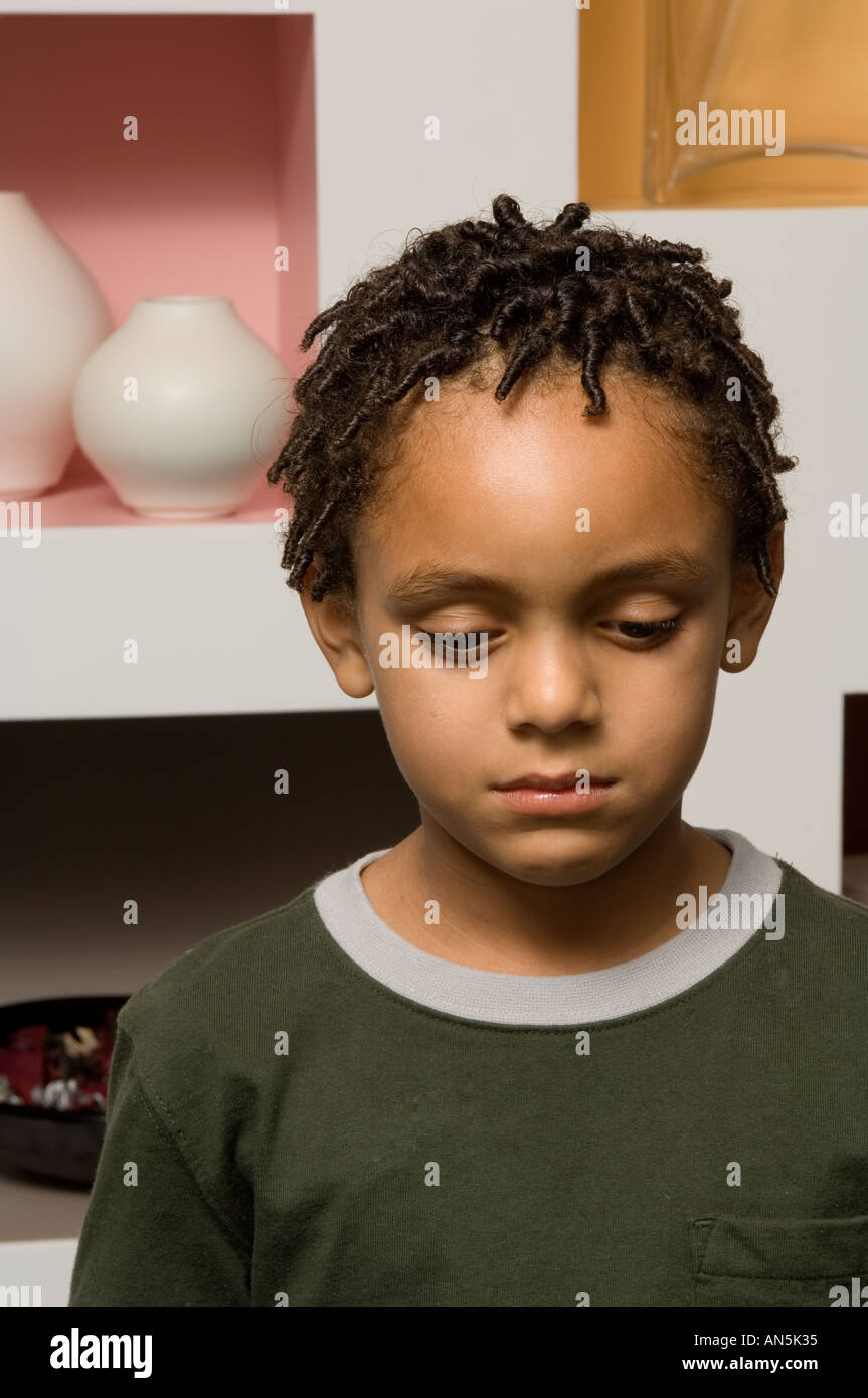 Portrait of a young boy who is sad Stock Photo - Alamy