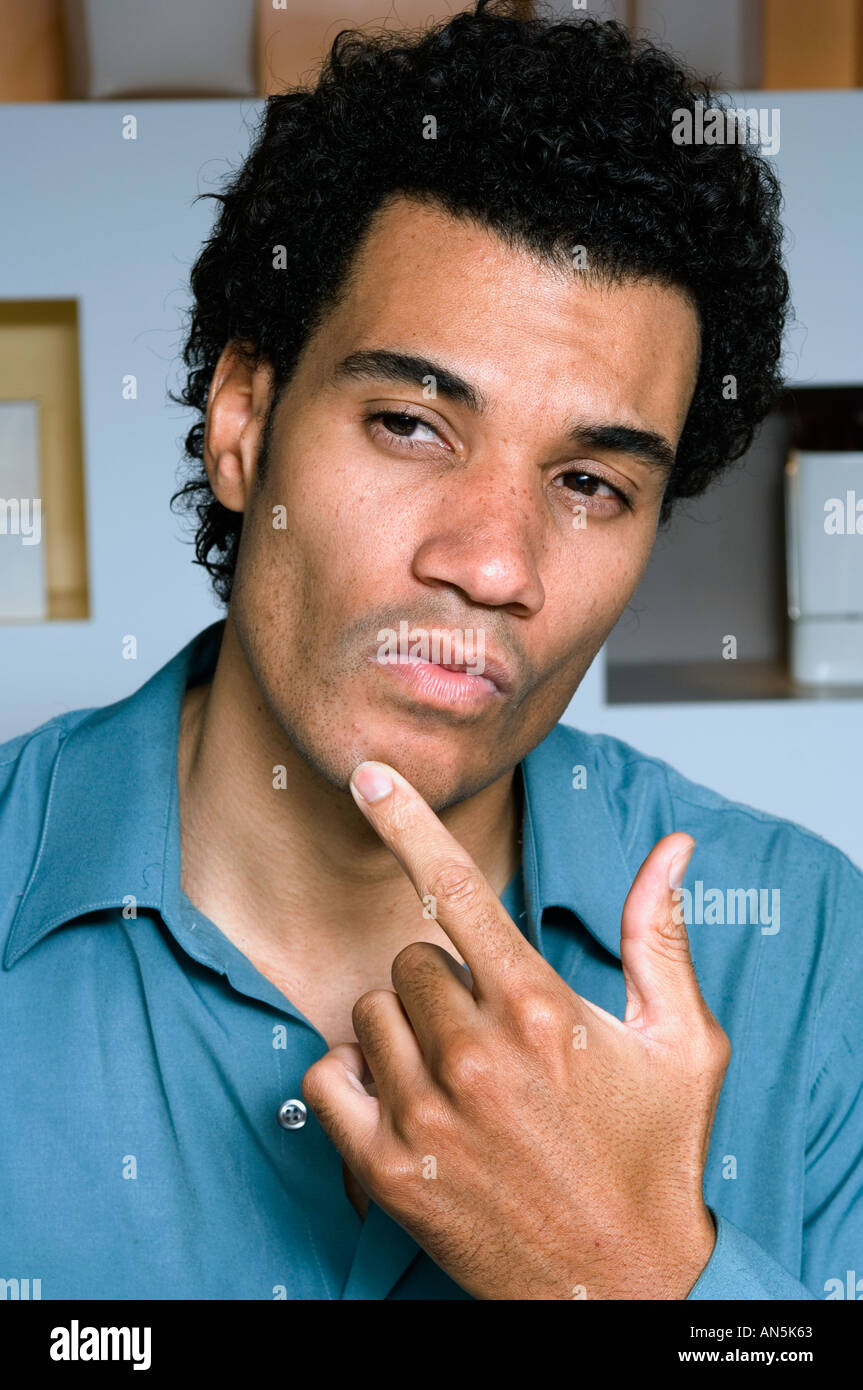 Portrait of an attractive male thinking Stock Photo - Alamy