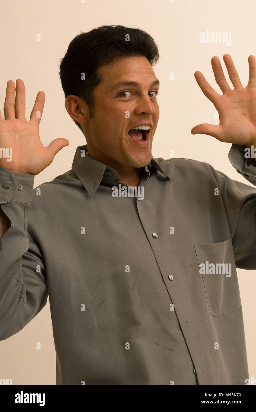 Portrait of male throwing his hands up into the air Stock Photo - Alamy