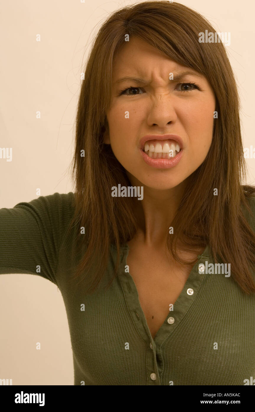 Young woman gritting teeth hi-res stock photography and images - Alamy
