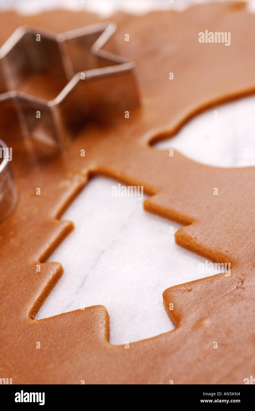 Gingerbread dough with christmas tree cut out Stock Photo - Alamy