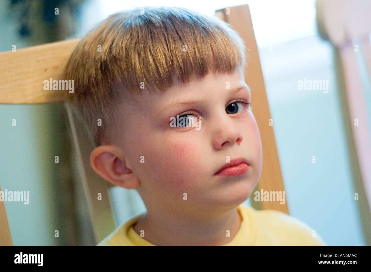 Child serious face boy Stock Photo - Alamy