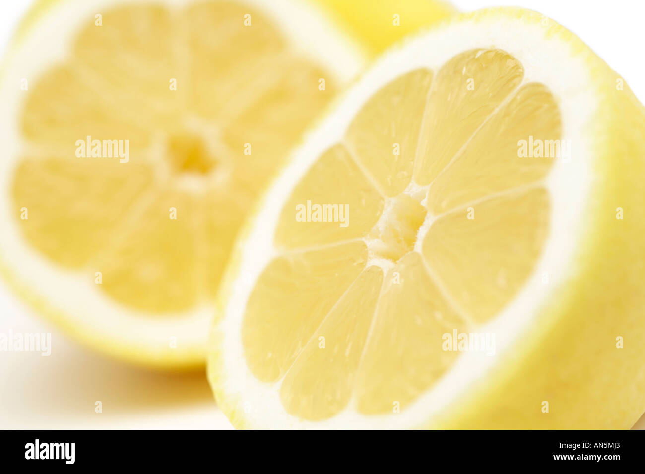Lemon halved close up on white background Stock Photo - Alamy