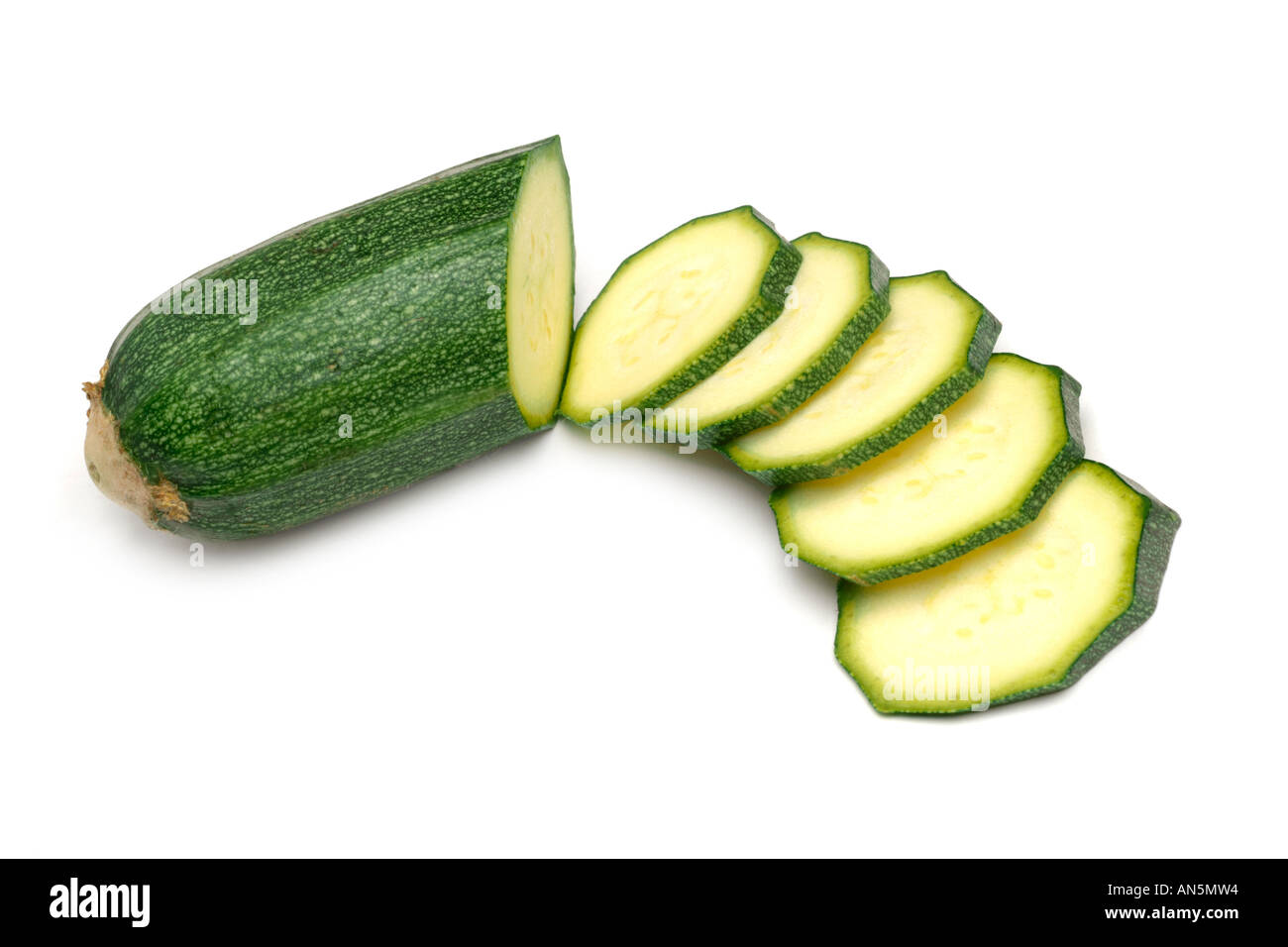 Courgette zucchini slices on white background Stock Photo - Alamy