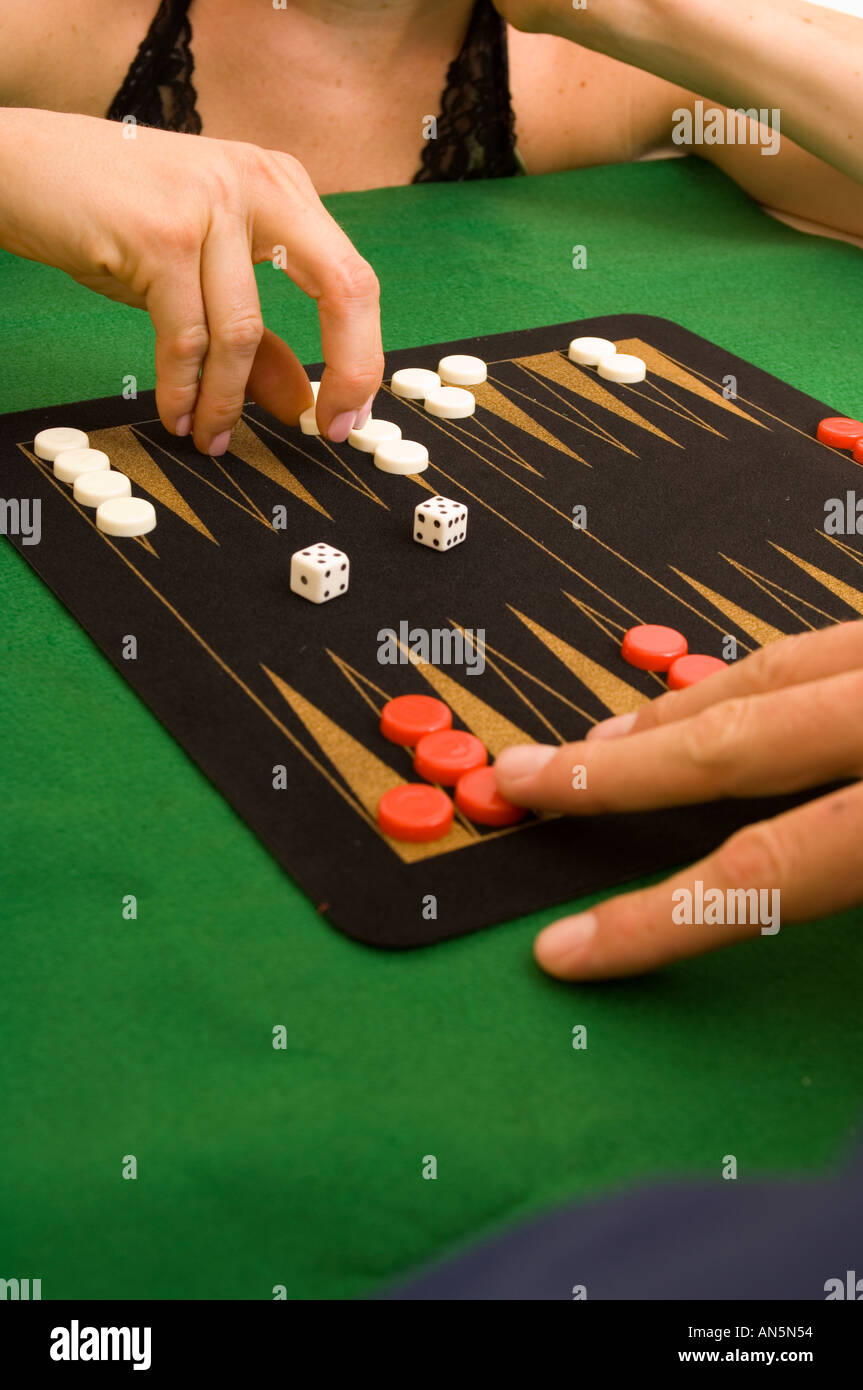 Portrait of two people playing backgammon Stock Photo - Alamy