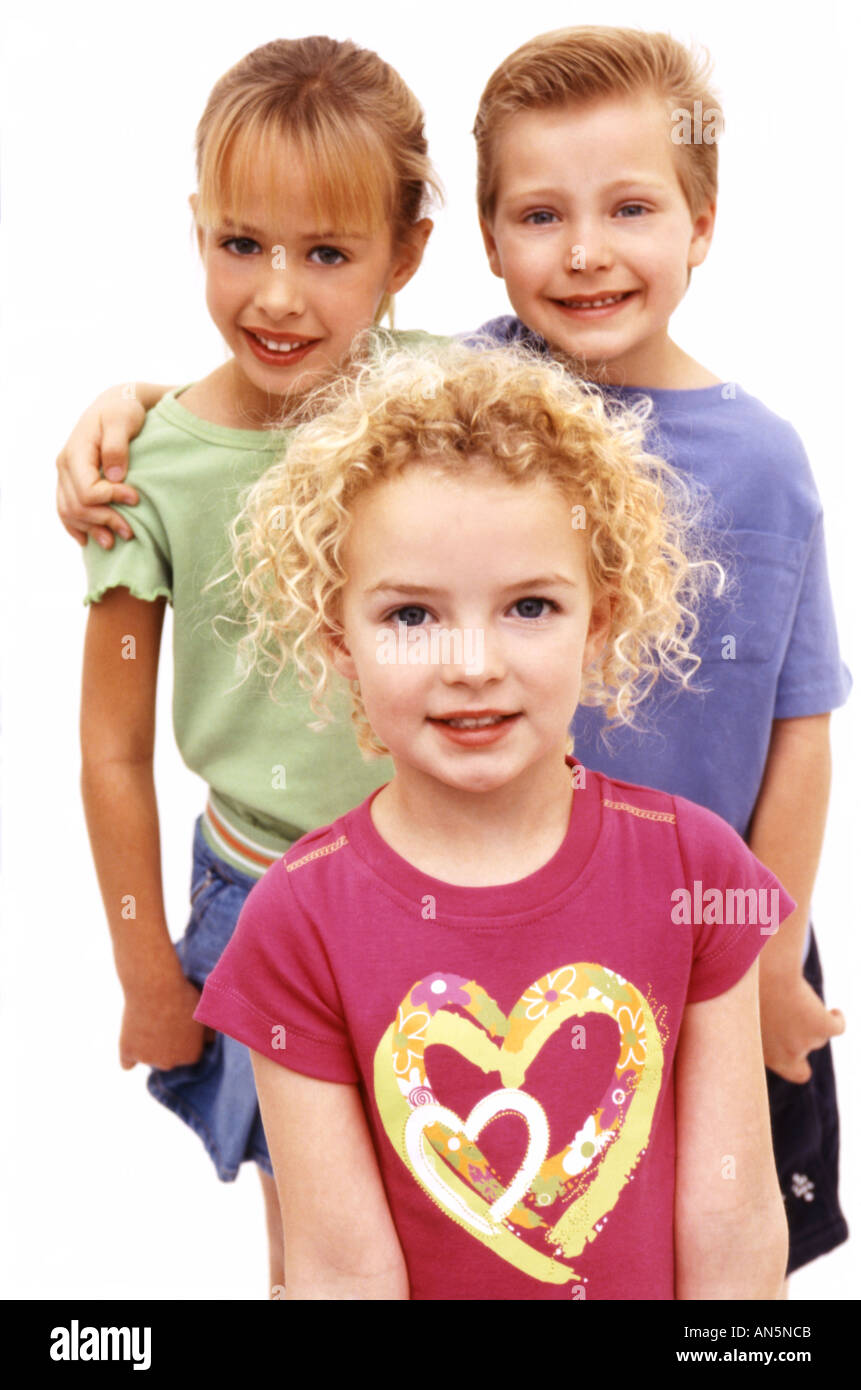 Three young children smiling Stock Photo - Alamy