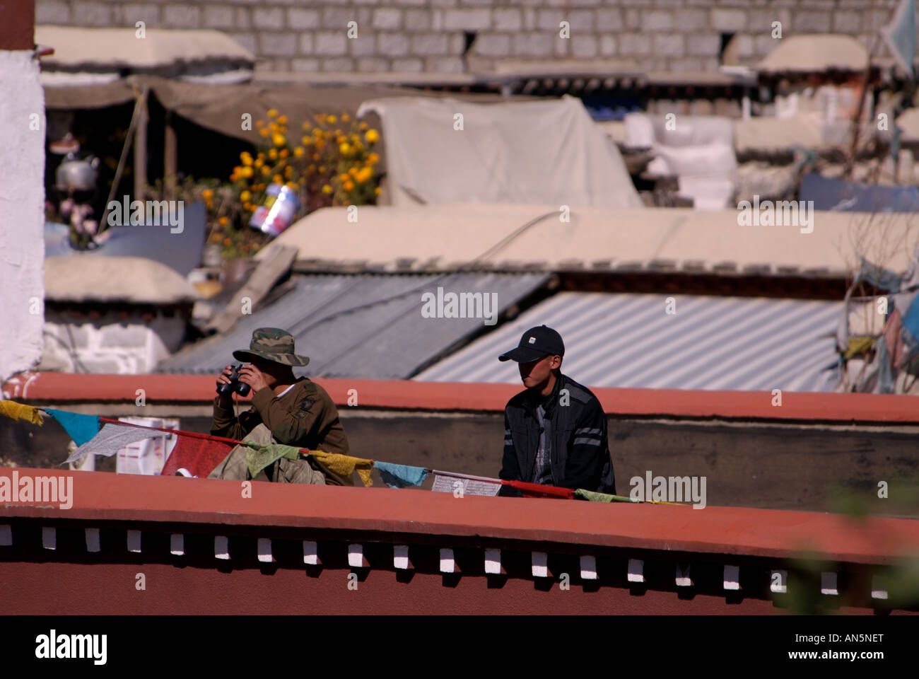Chinese police watching over pilgims in Barkor Square and the Jokhang ...