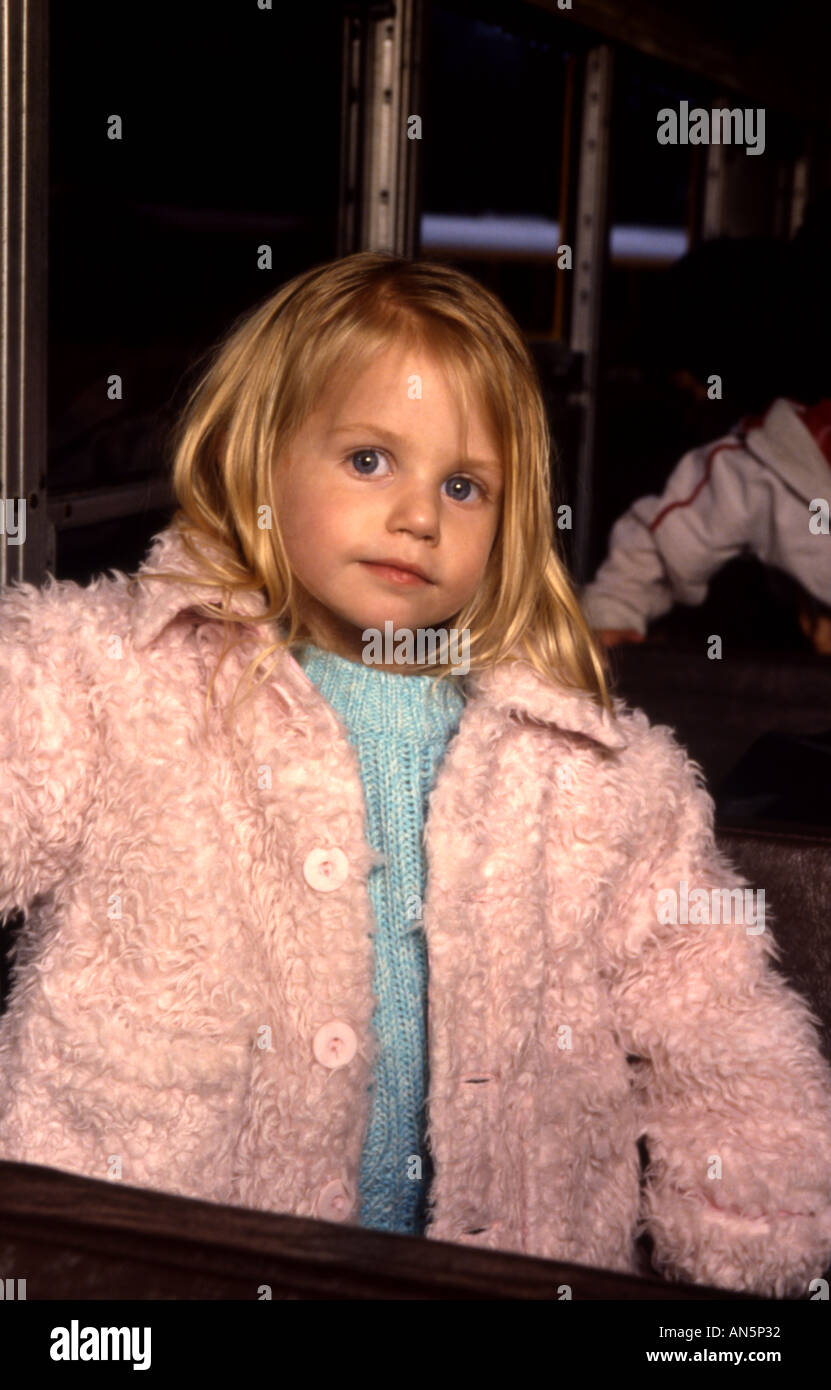 A young girl poses inside of a school bus Stock Photo - Alamy
