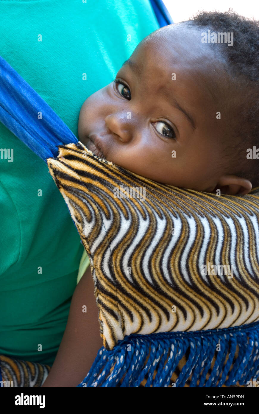 Baby being carried in Windhoek, namibia Stock Photo - Alamy