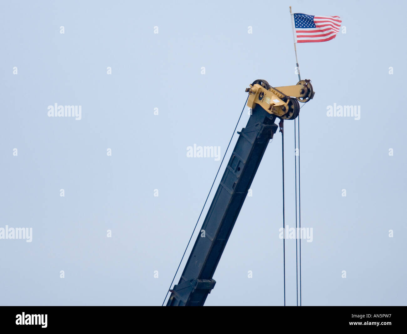 American flag on top of a derrick at a construction site Stock Photo ...