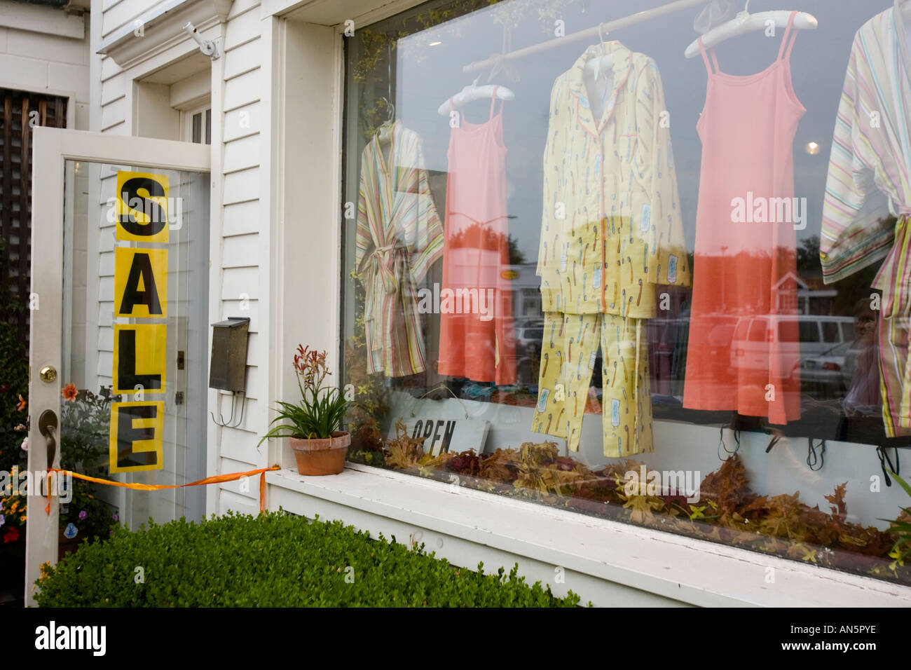 Clothes on sale at a dress shop Stock Photo - Alamy
