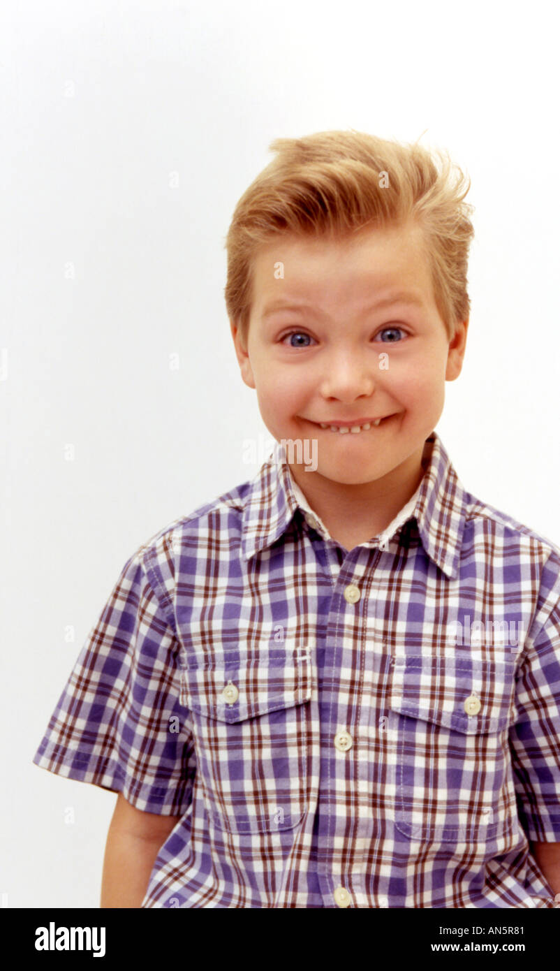 A young boy smiles for the camera Stock Photo - Alamy
