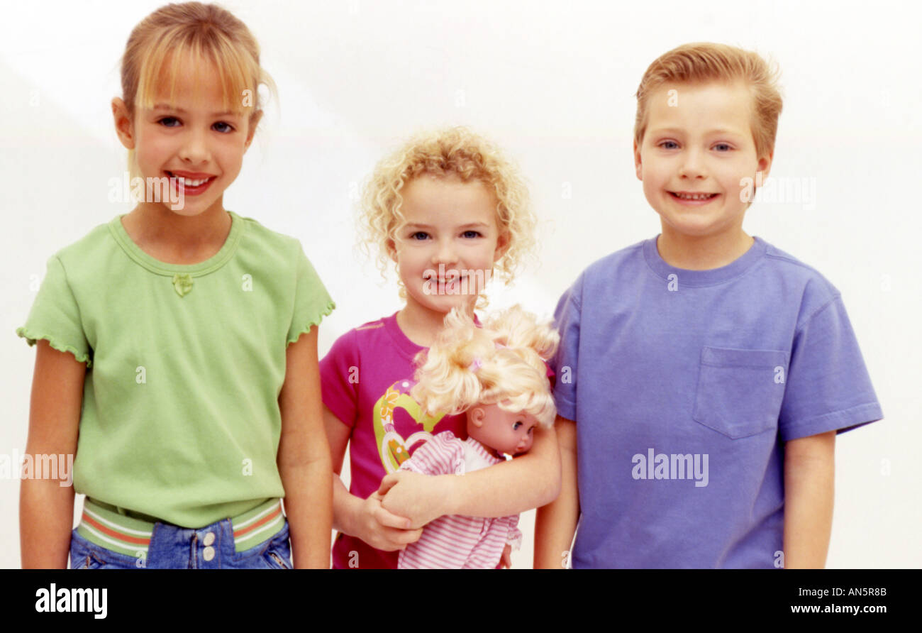 Three young children smile together Stock Photo - Alamy
