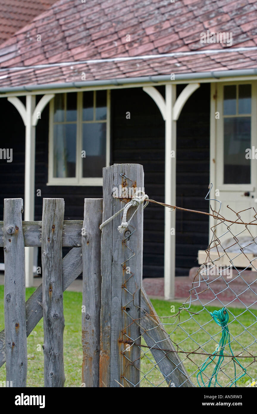 Gate next to a seaside hut Stock Photo - Alamy