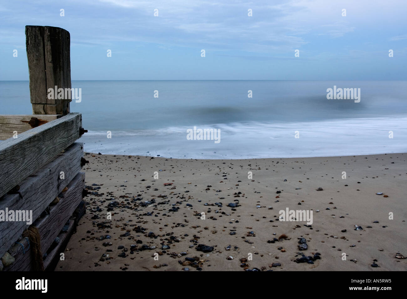 Night shot of beach with sea breakers Stock Photo - Alamy