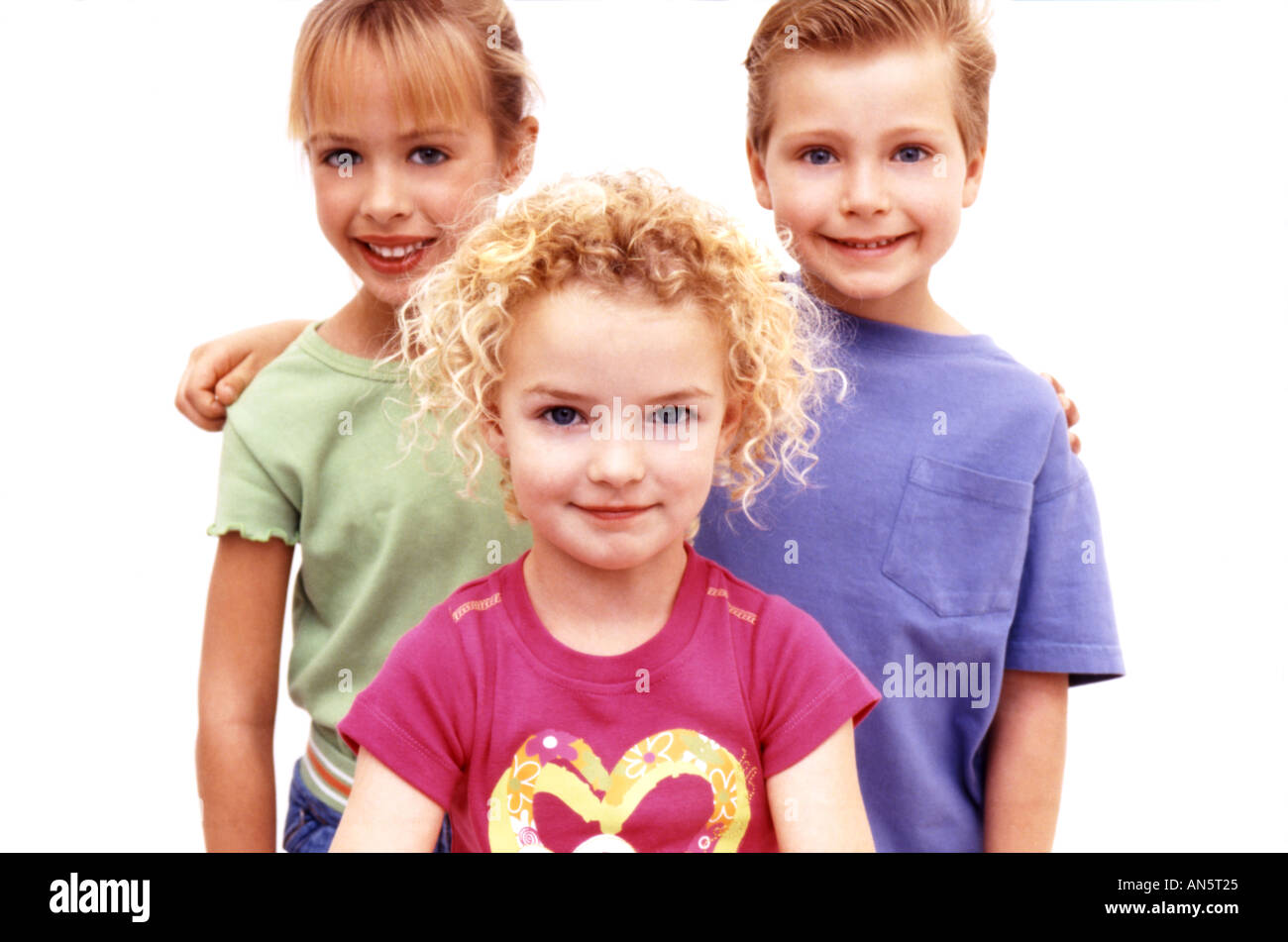Three young children smiling Stock Photo - Alamy