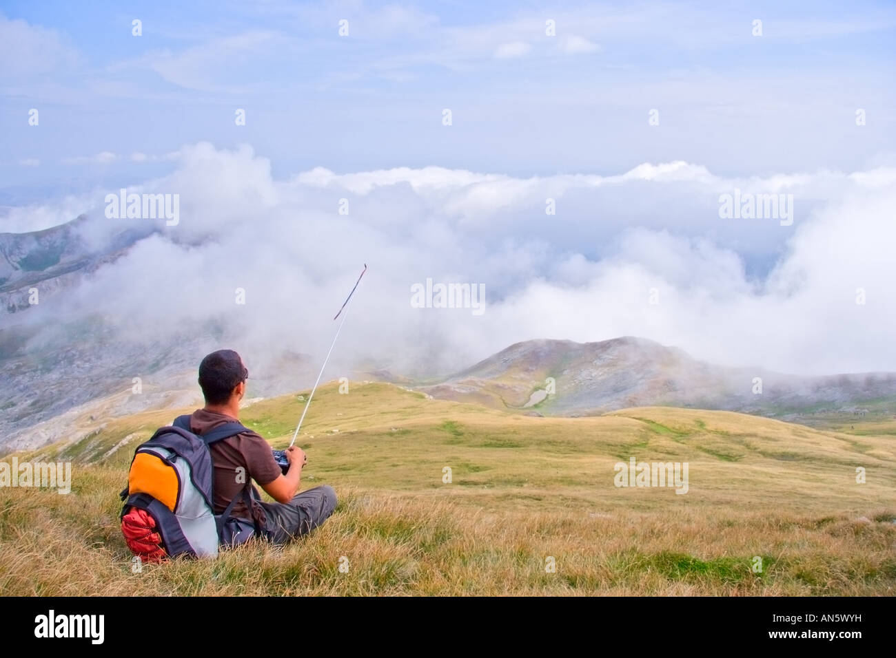 Man on a top of the mountain Stock Photo - Alamy